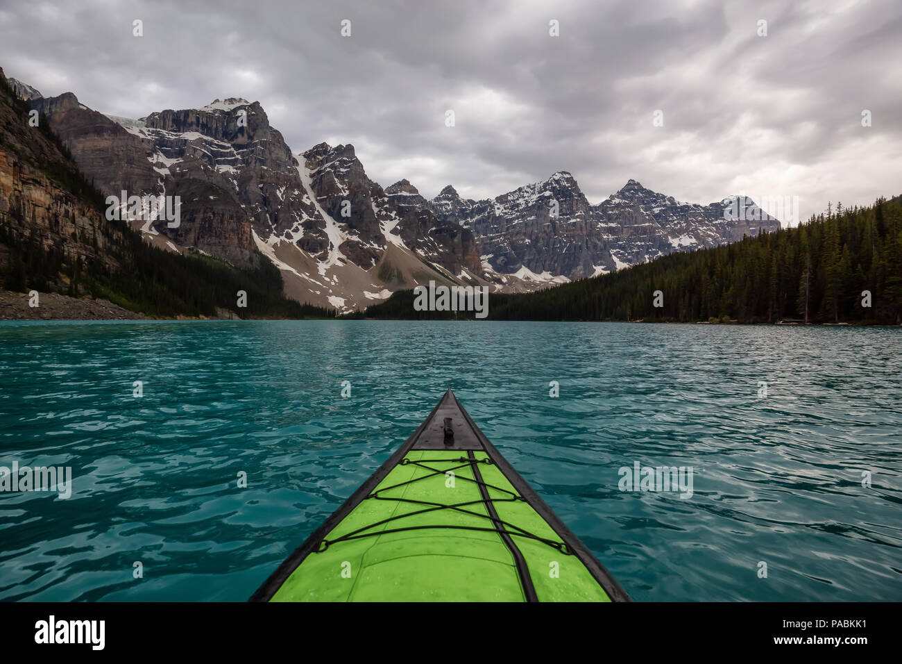 Kayaking in Glacier Water surounded by the beautiful Canadian Rocky ...
