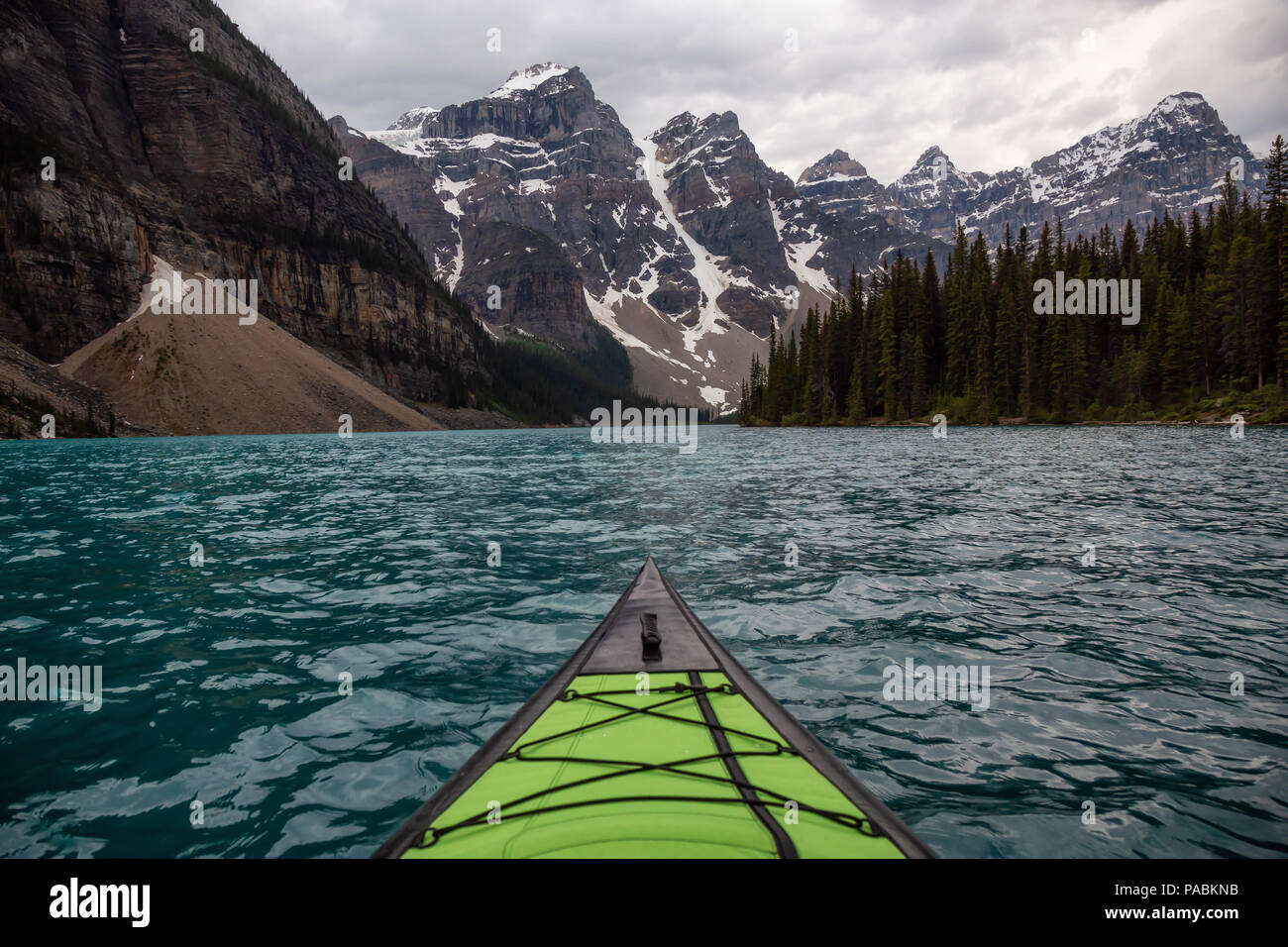 Kayaking in Glacier Water surounded by the beautiful Canadian Rocky ...