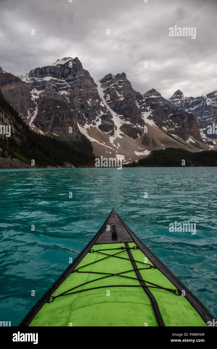 Kayaking in Glacier Water surounded by the beautiful Canadian Rocky ...