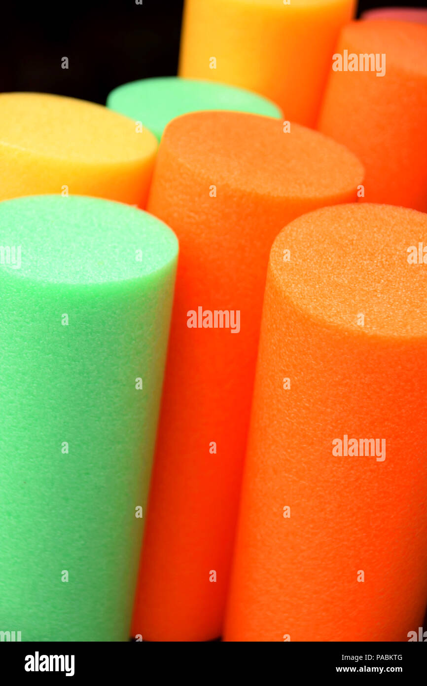 colorful pool noodles background, pool or therapy or swim noodles in ...