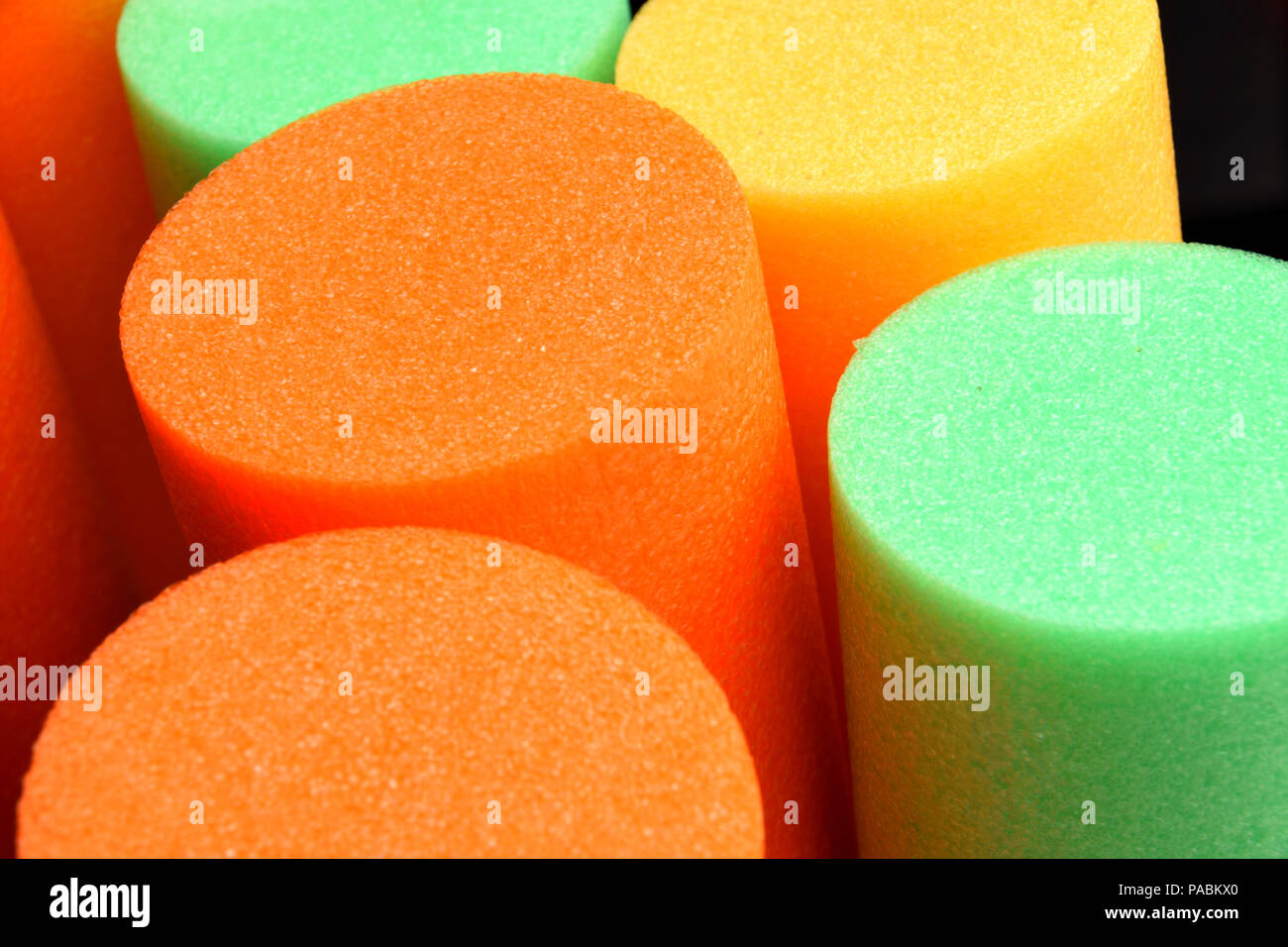 pool or therapy or swim noodles in modern colors detail shot, group of ...