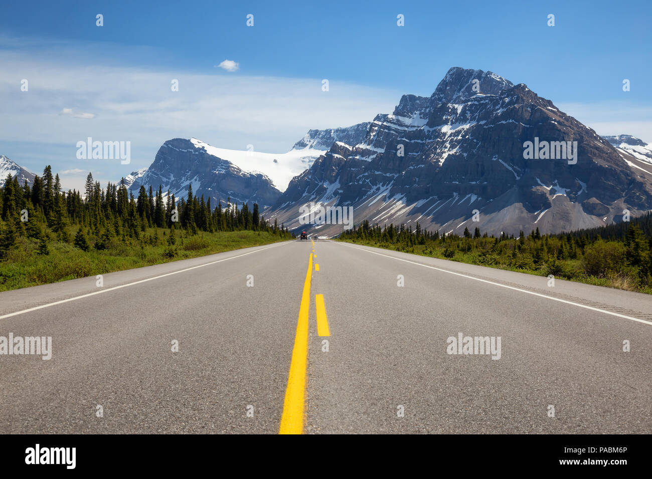 Scenic road in the Canadian Rockies during a vibrant sunny summer day. Taken in Icefields ...