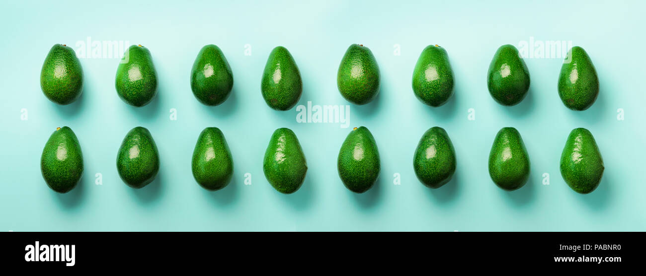 Green avocado pattern on blue background. Banner. Top view. Pop art ...