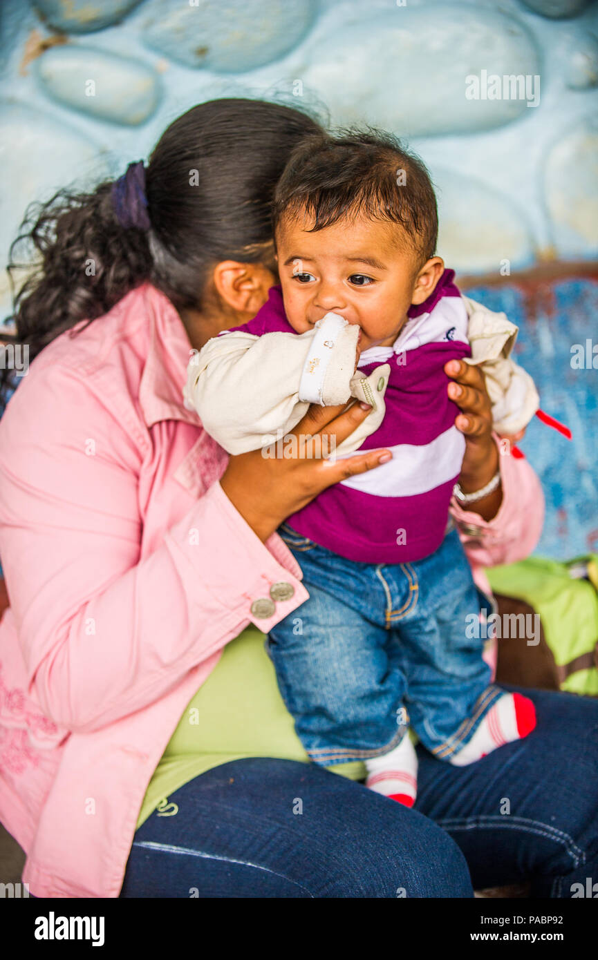 SAN JOSE, COSTA RICA - JAN 6, 2012: Unidentified Costa Rican mother and ...