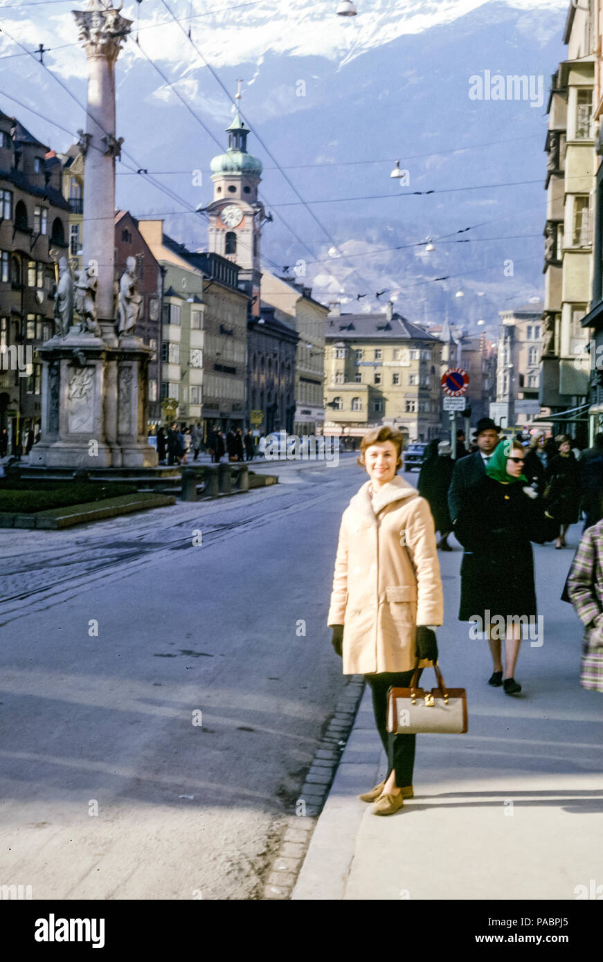 Female American tourist standing on roadside, Maria Theresa Street ...