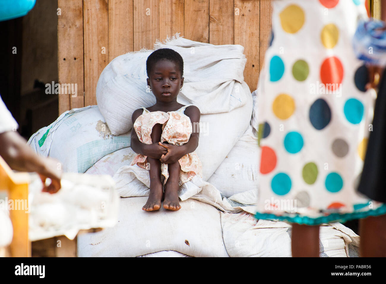 GHANA - MARCH 2, 2012: Unindentified Ghanaian little girl sits in Ghana ...
