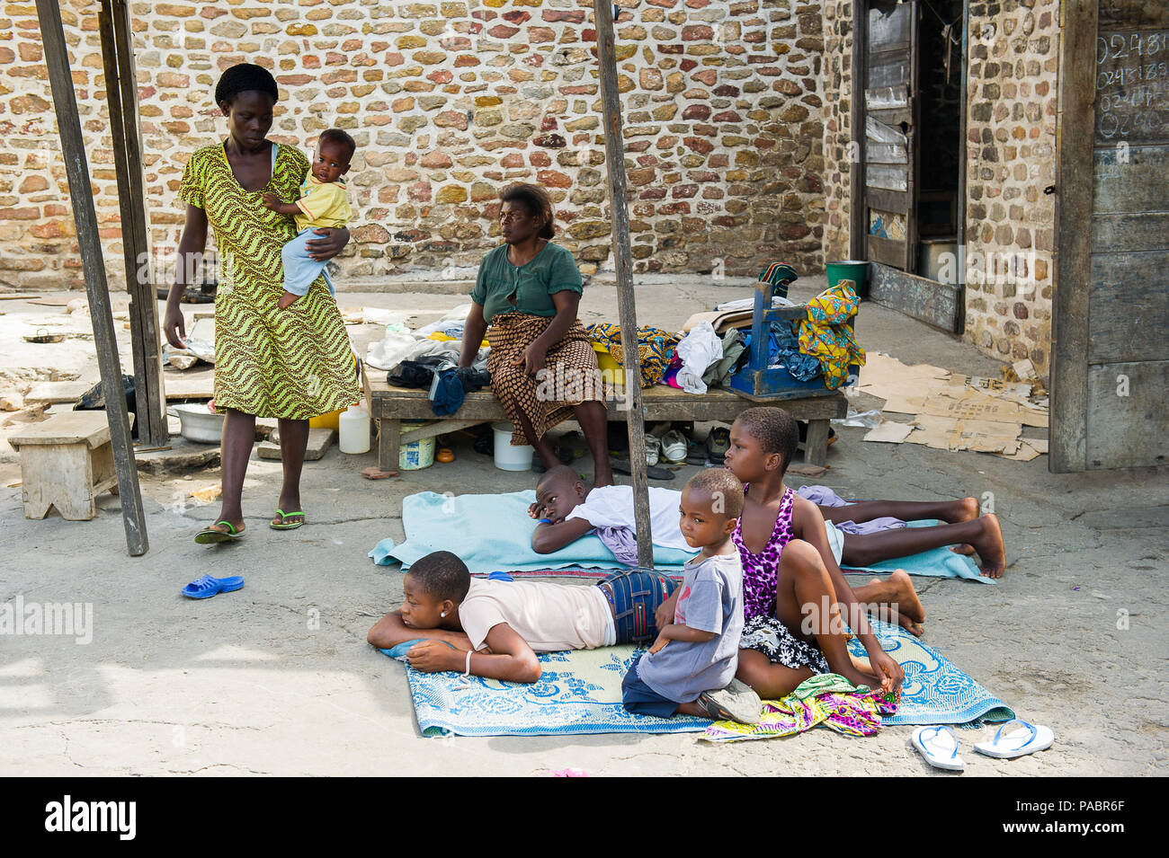 GHANA - MARCH 2, 2012: Unindentified Ghanaian people and children lay ...