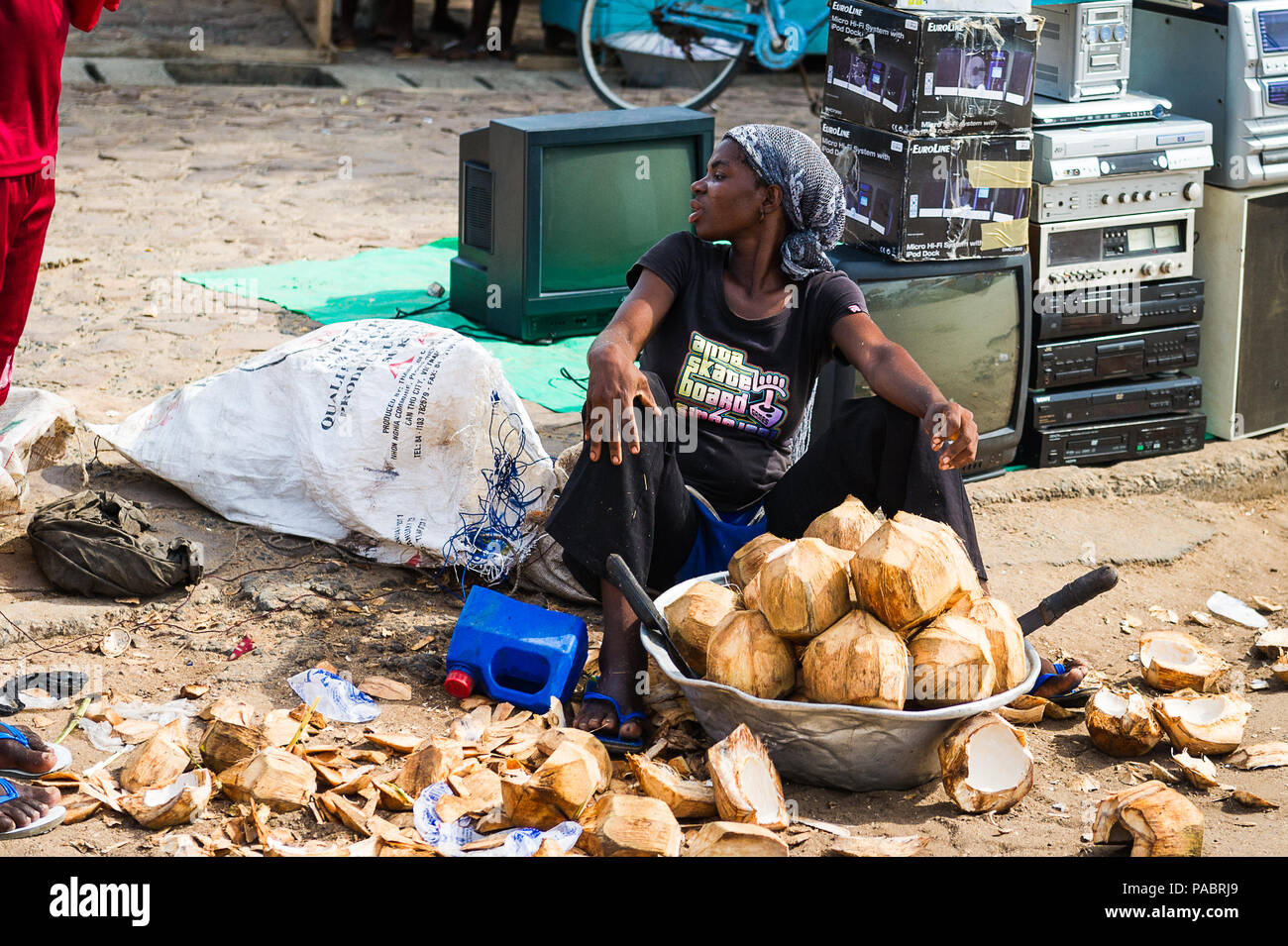 ACCRA, GHANA - MARCH 2, 2012: Unidentified Ghanaian woman works at the ...
