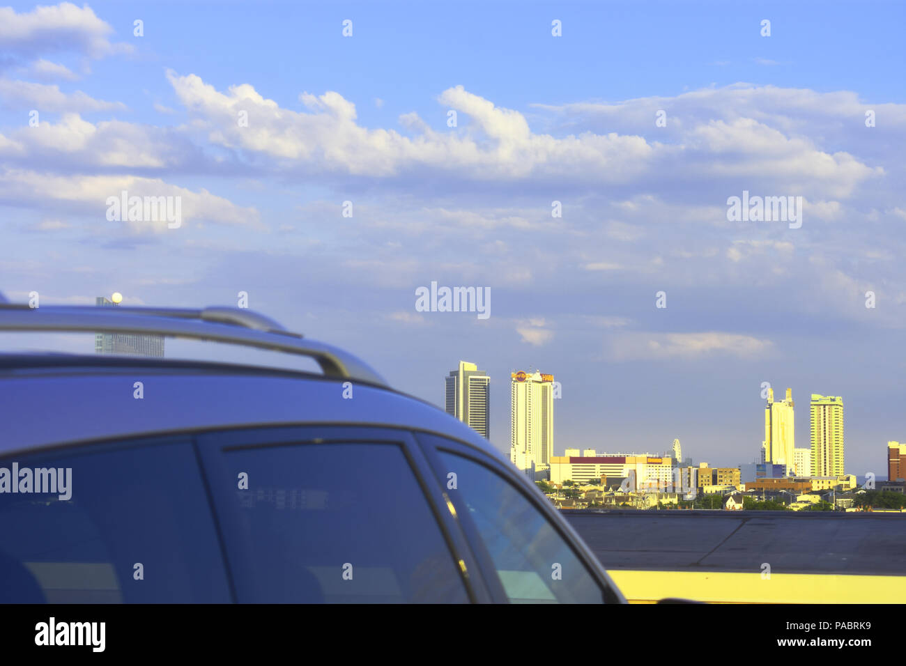 Beautiful sky and city skyline visible over roof of automobile Stock ...