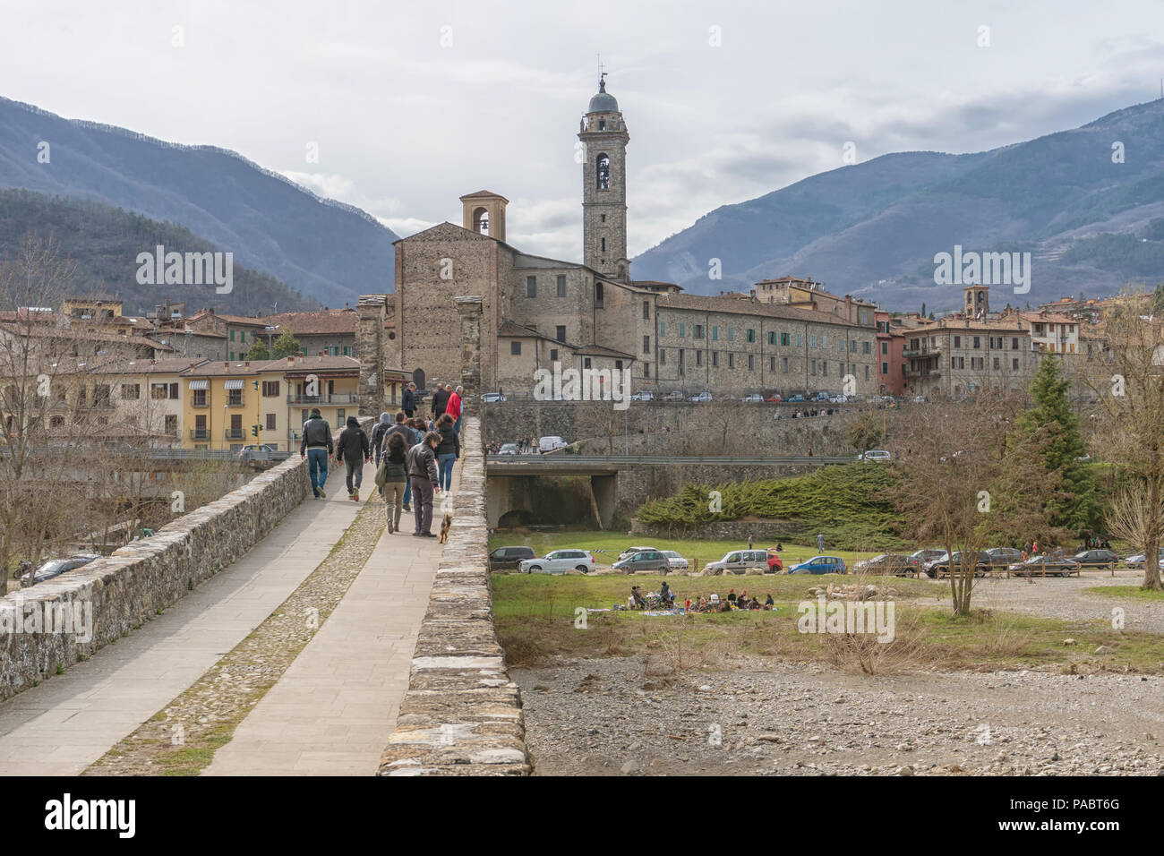 Bobbio,Italy-april 2,2018:people stroll on the old medieval bridge ...