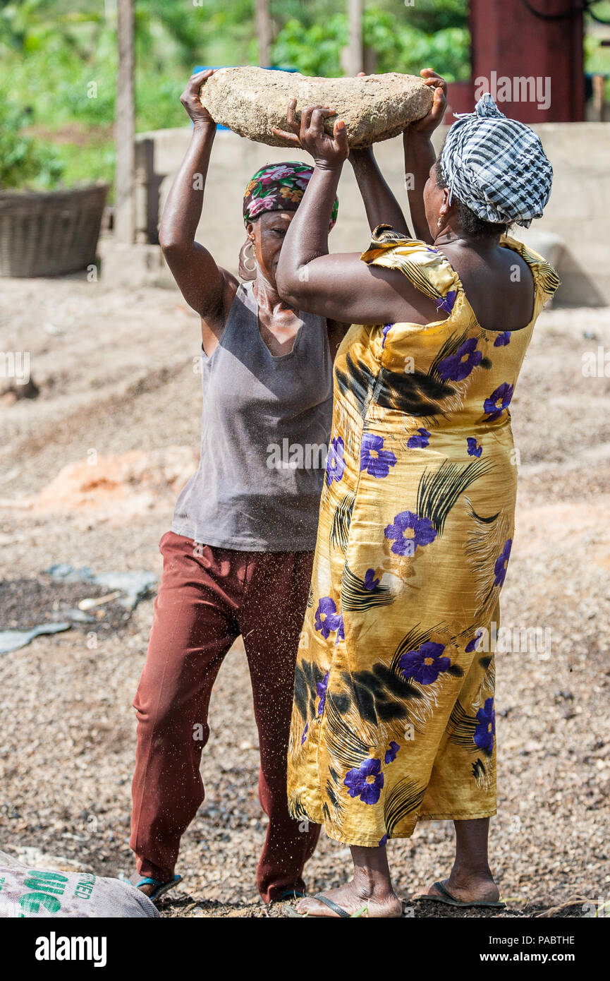 ACCRA, GHANA - MARCH 3, 2012: Unidentified Ghanaian two women transport ...