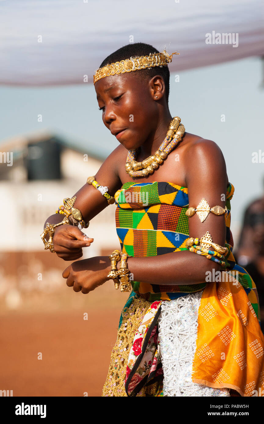 GHANA - MARCH 3, 2012: Ghanaian girl in national colors clothes dances ...
