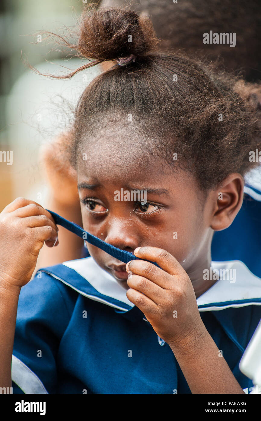 ACCRA, GHANA - MARCH 4, 2012: Unidentified Ghanaian girl cries in a ...