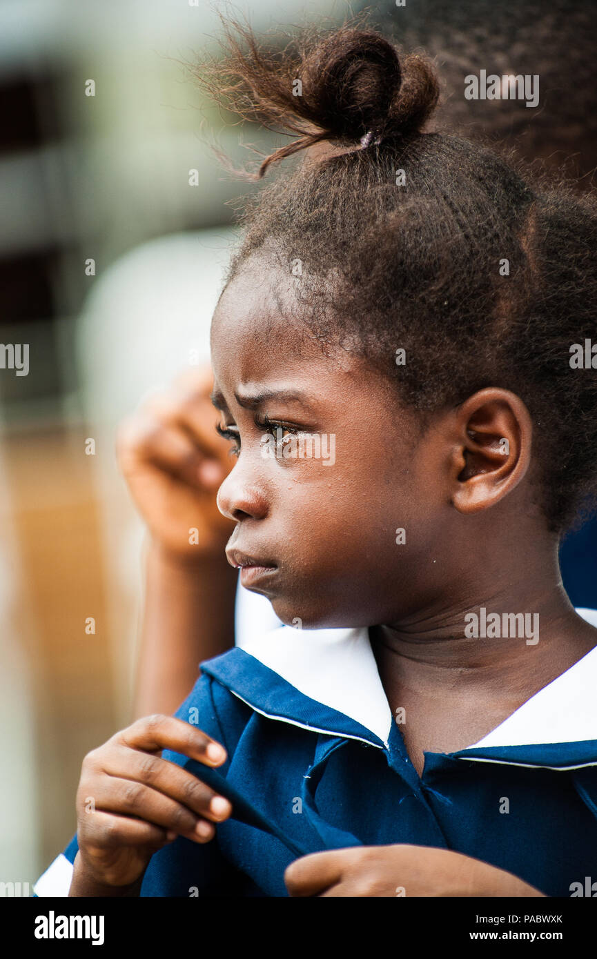 ACCRA, GHANA - MARCH 4, 2012: Unidentified Ghanaian girl cries in a ...