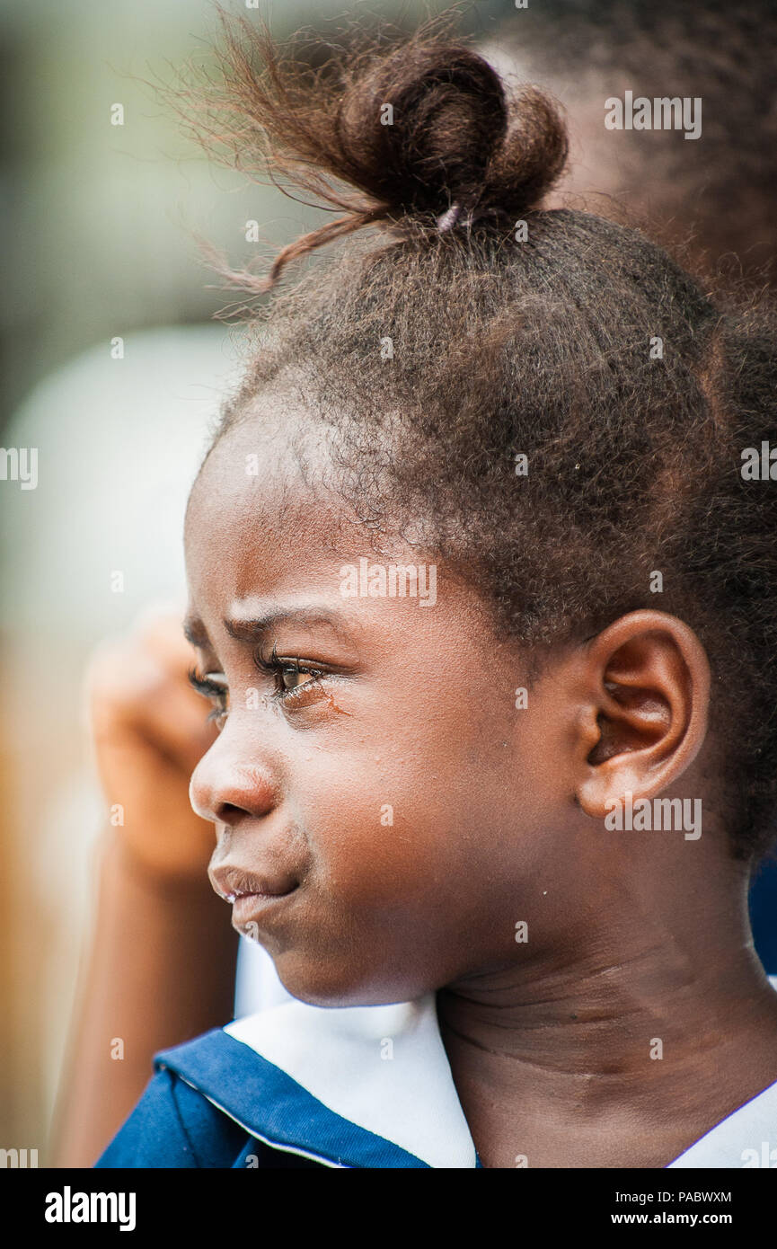 ACCRA, GHANA - MARCH 4, 2012: Unidentified Ghanaian girl cries in a ...
