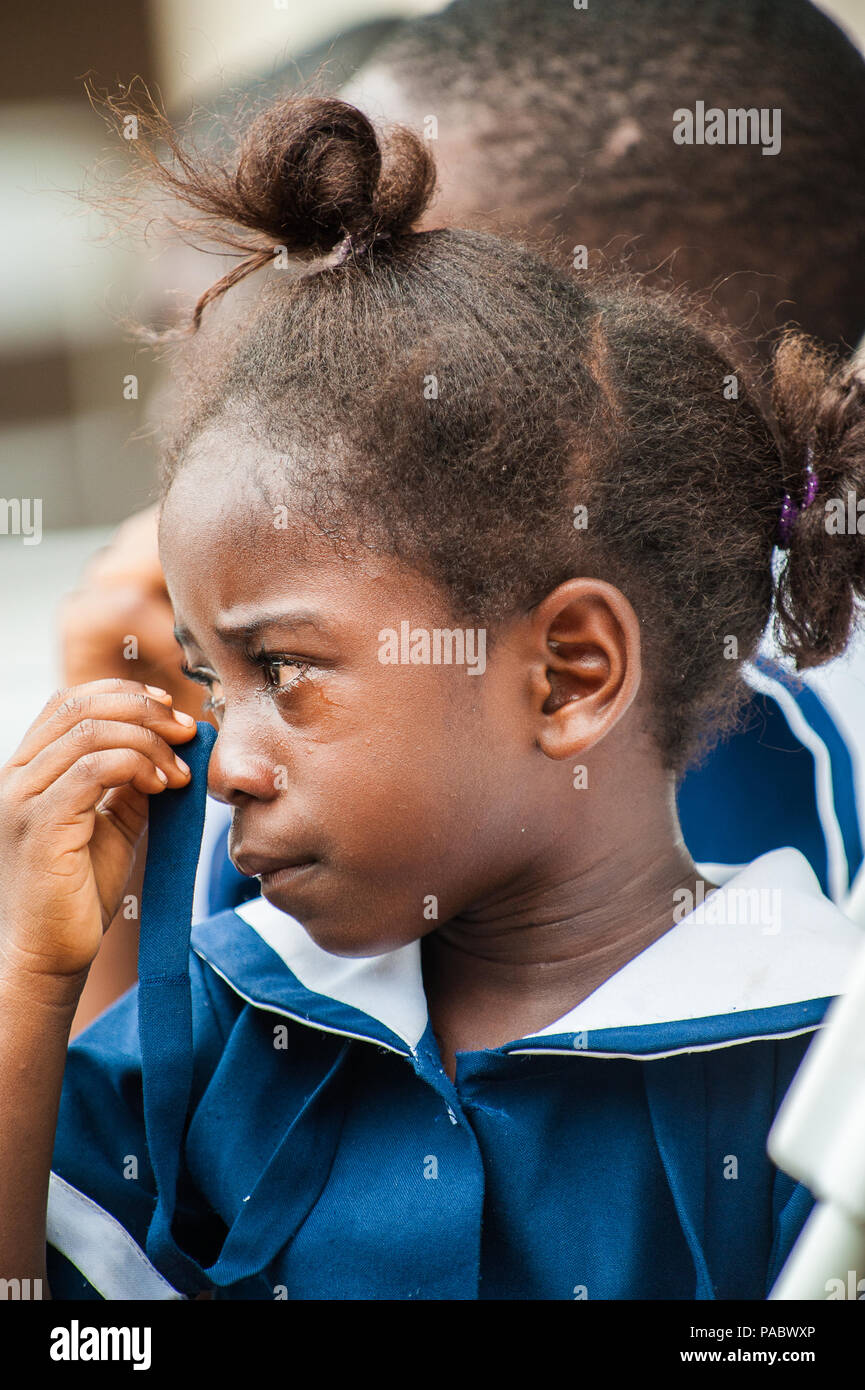ACCRA, GHANA - MARCH 4, 2012: Unidentified Ghanaian girl cries in a ...
