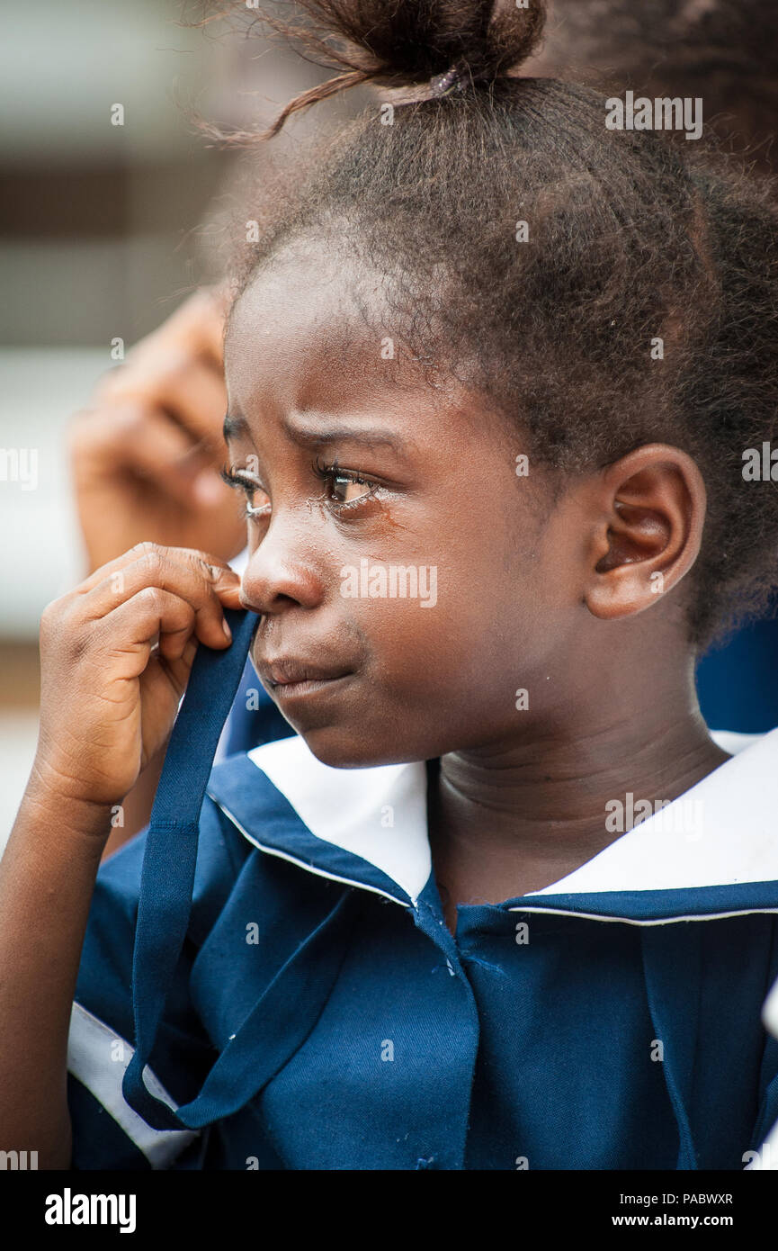 ACCRA, GHANA - MARCH 4, 2012: Unidentified Ghanaian girl cries in a ...