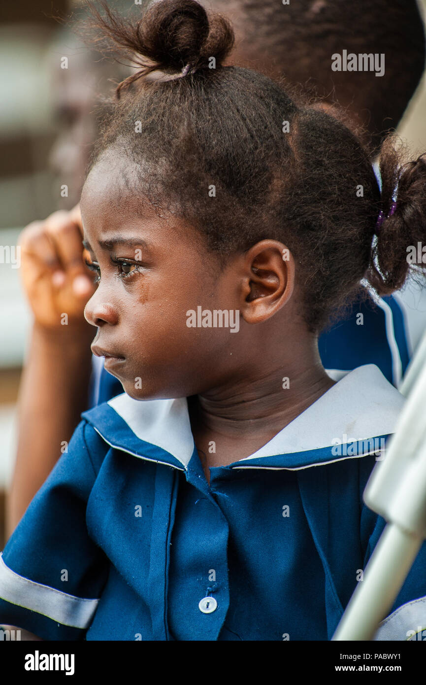 ACCRA, GHANA - MARCH 4, 2012: Unidentified Ghanaian girl cries in a ...