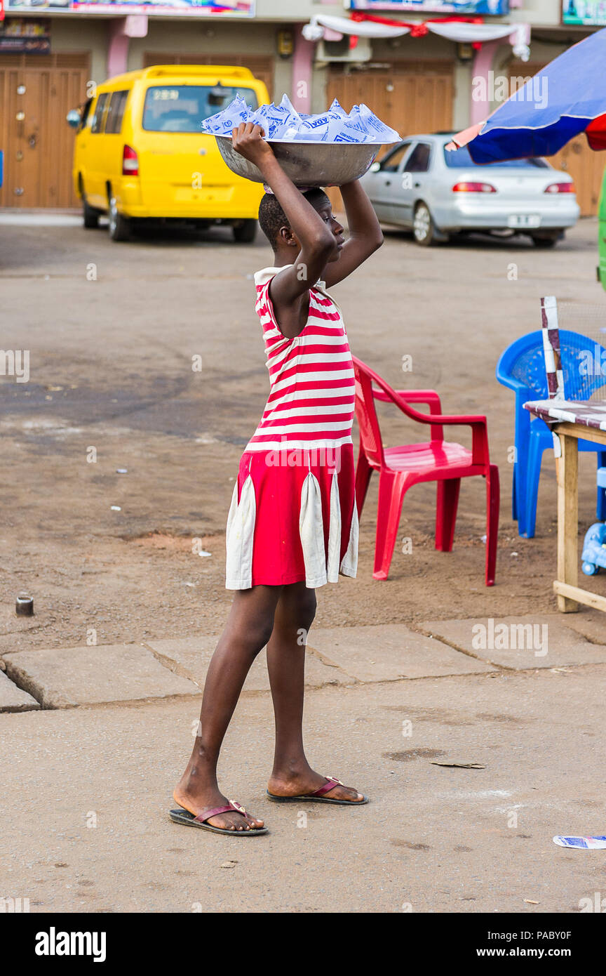ACCRA, GHANA - MARCH 4, 2012: Unidentified Ghanaian girl sells cold ...