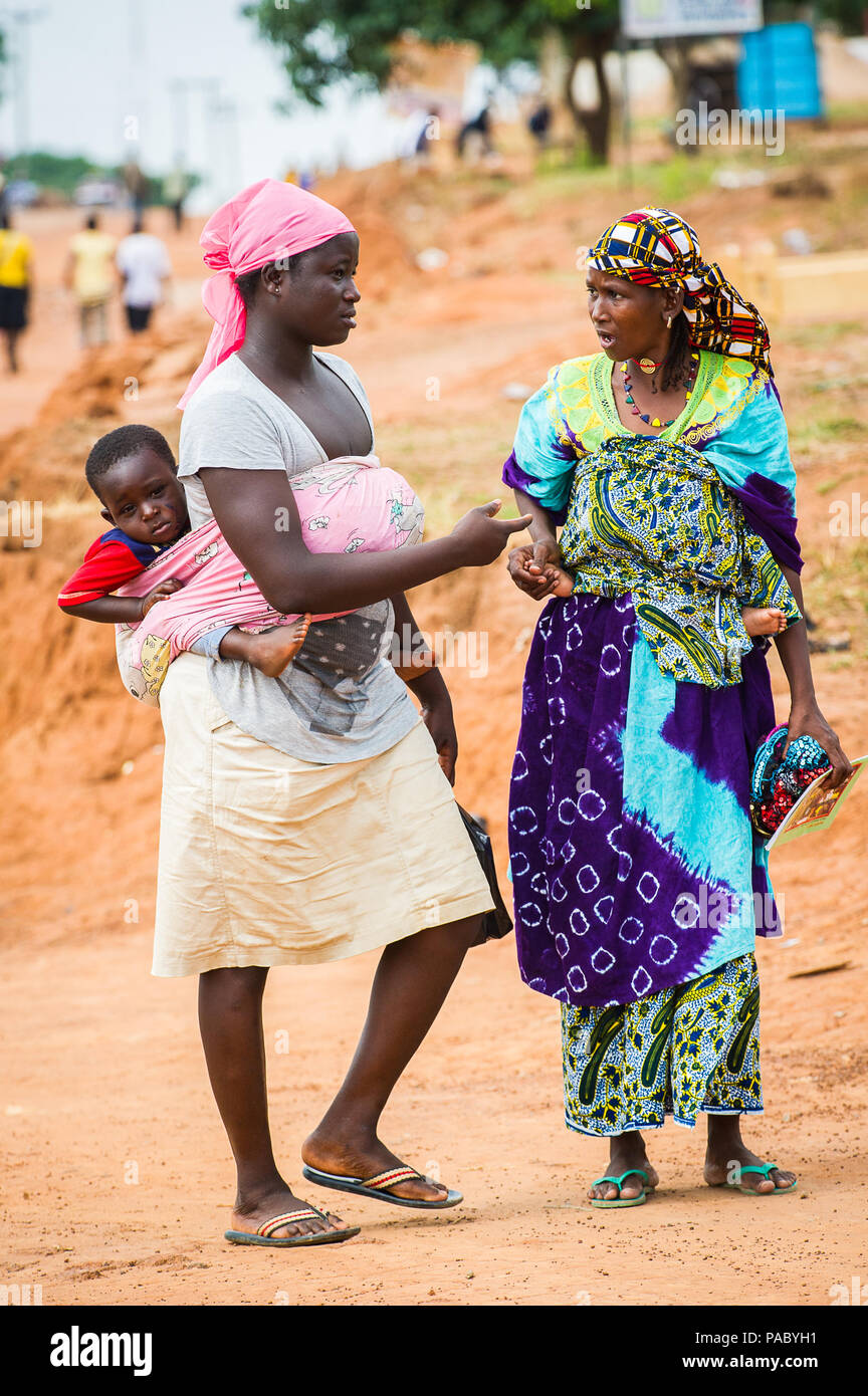 ACCRA, GHANA - MARCH 6, 2012: Unidentified Ghanaian women carry their ...