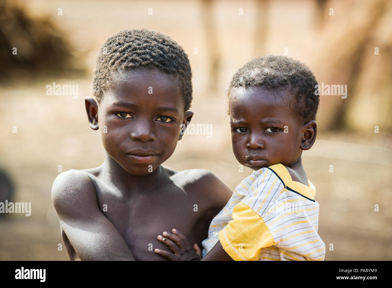 ACCRA, GHANA - MARCH 6, 2012: Unidentified Ghanaian boy holds his ...