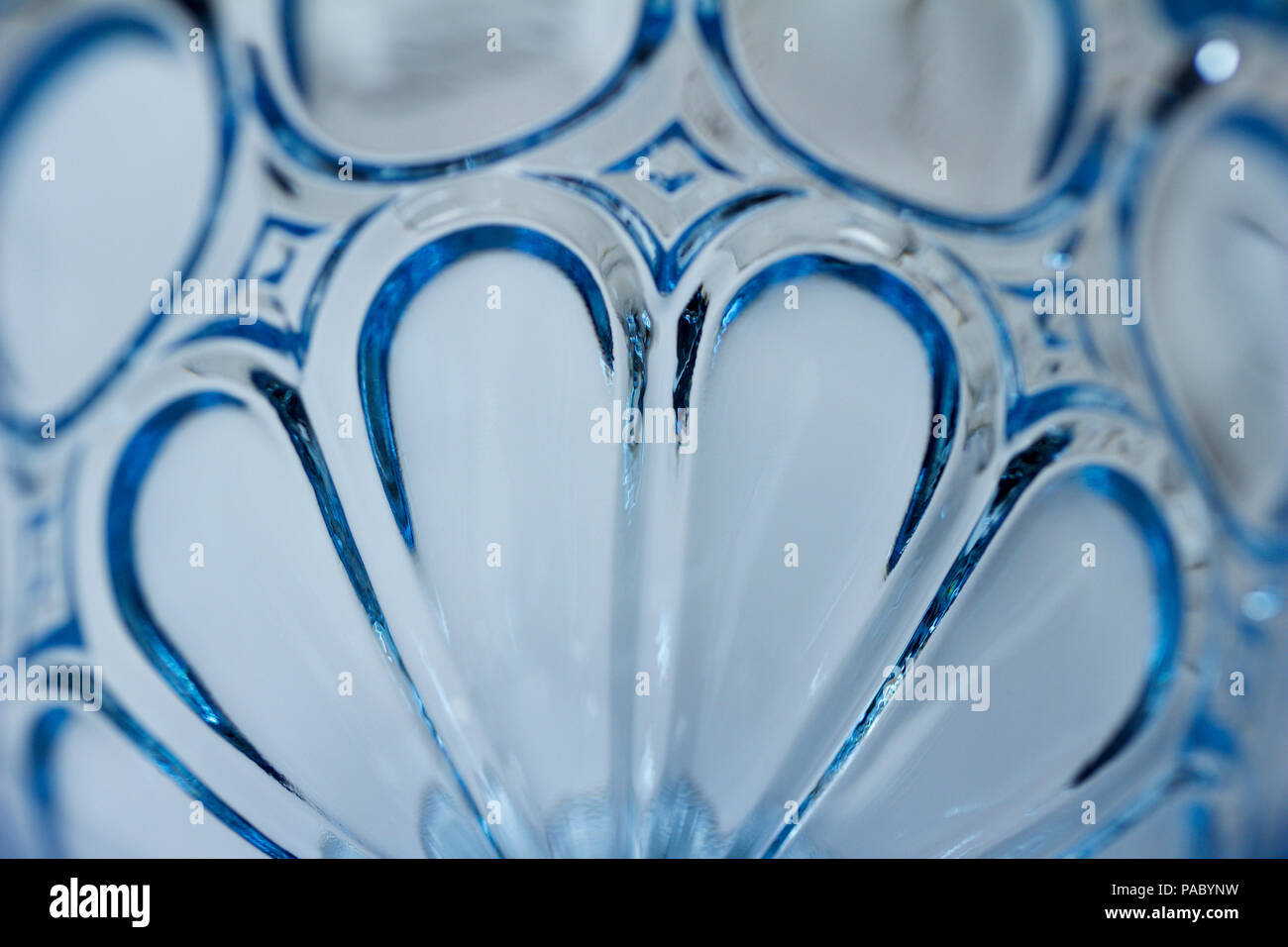 Macro abstract view of a single blue color crystal water or wine goblet ...