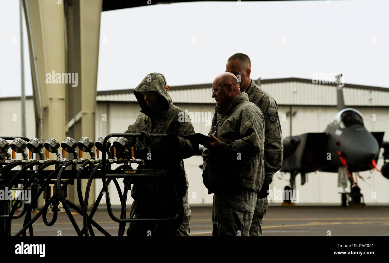 Members of the 142nd Maintenance Group operate a modular lift bag ...
