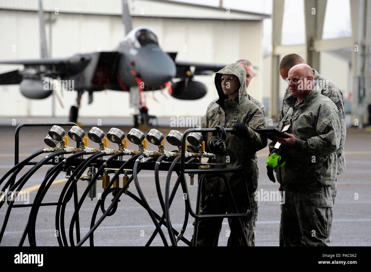 Members of the 142nd Maintenance Group operate a modular lift bag ...