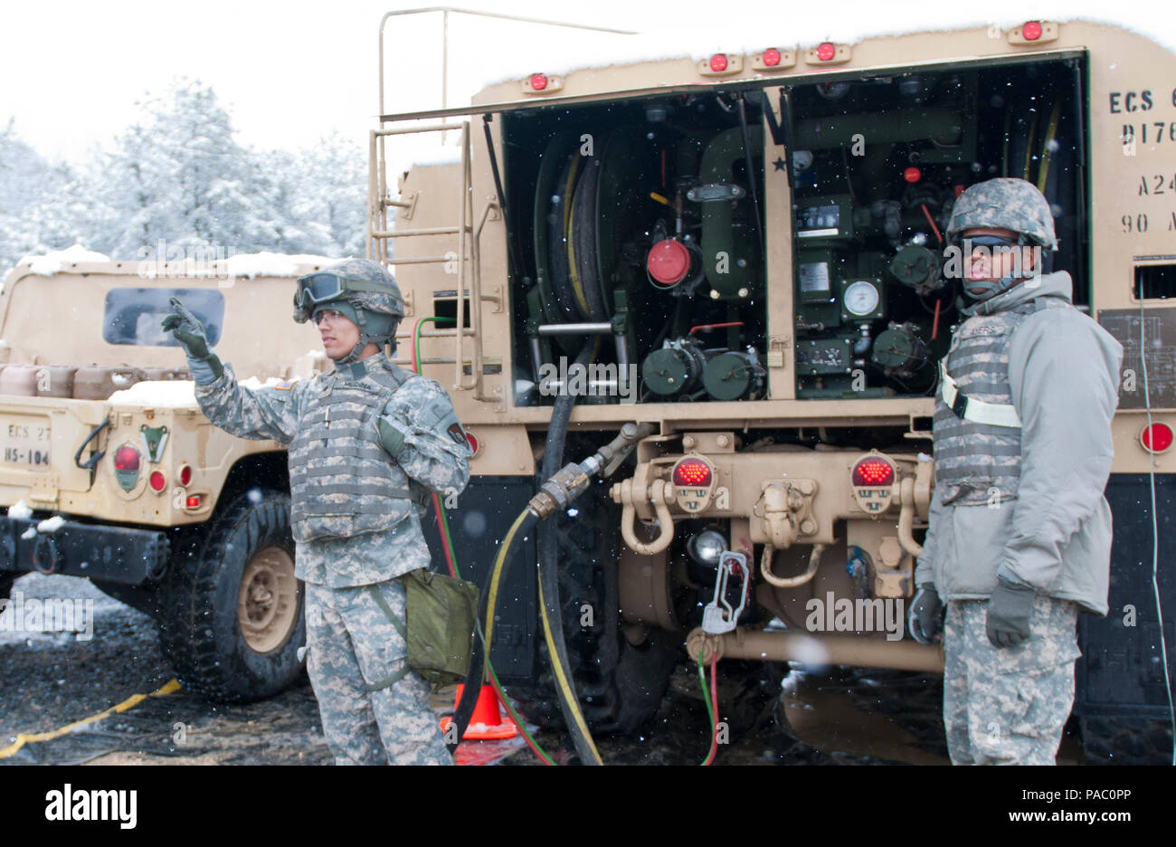Spc. Alexander Medina (left) and Spc. Phillip Ayers (right), of the ...