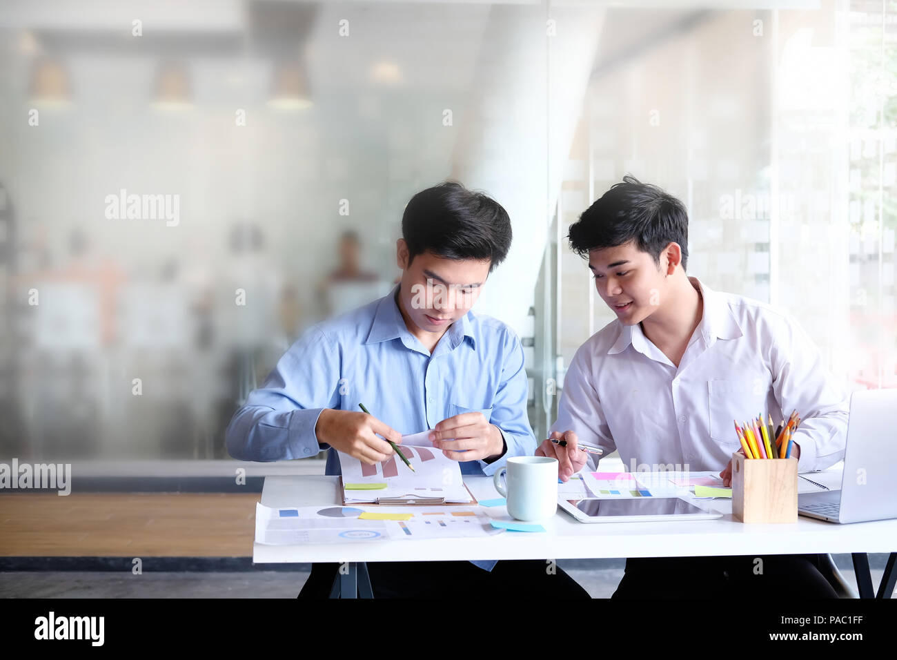 Young asian account manager consultant hi-res stock photography and ...