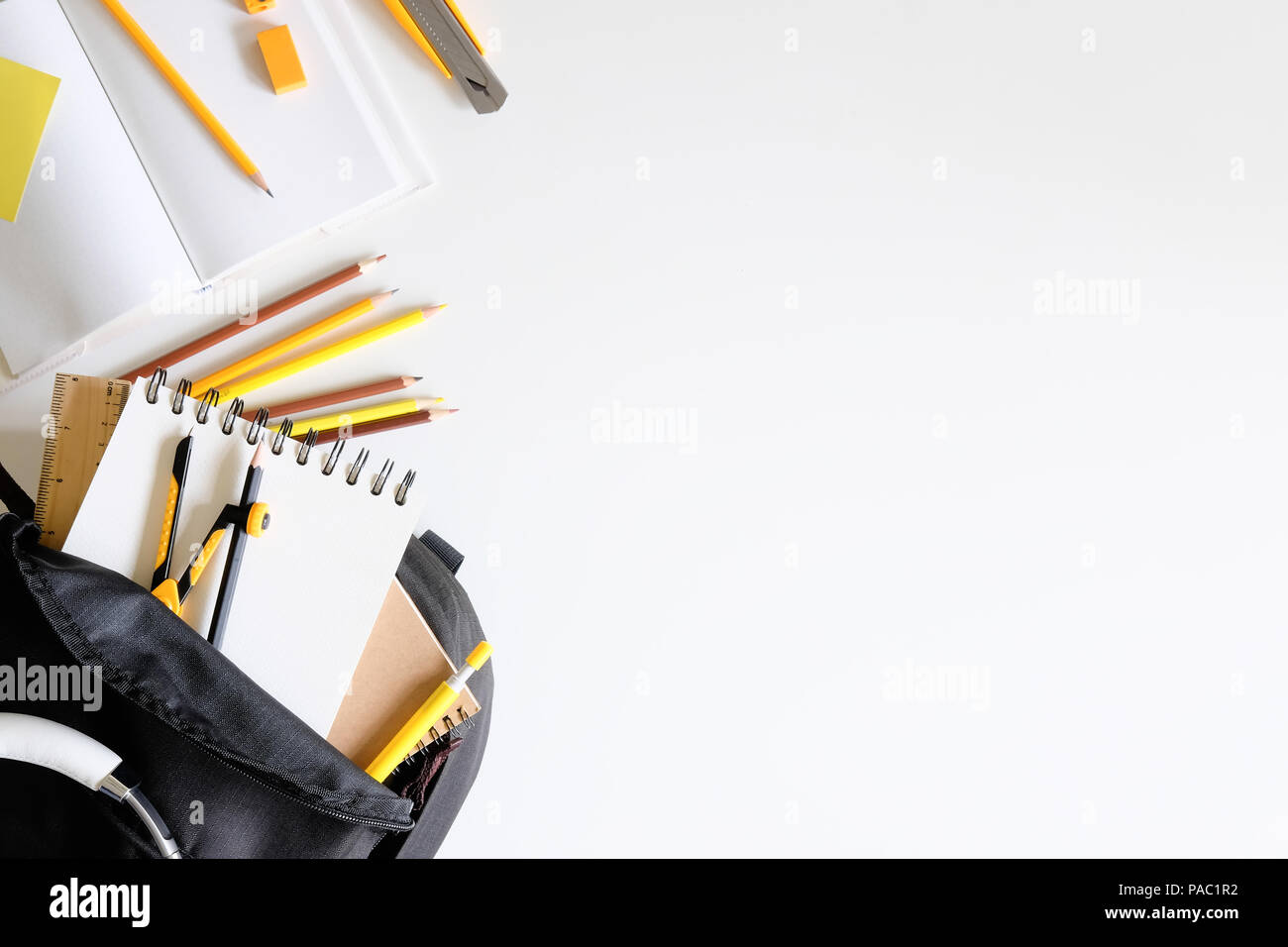 Back to school. Items for the school supplies on white table ready for ...
