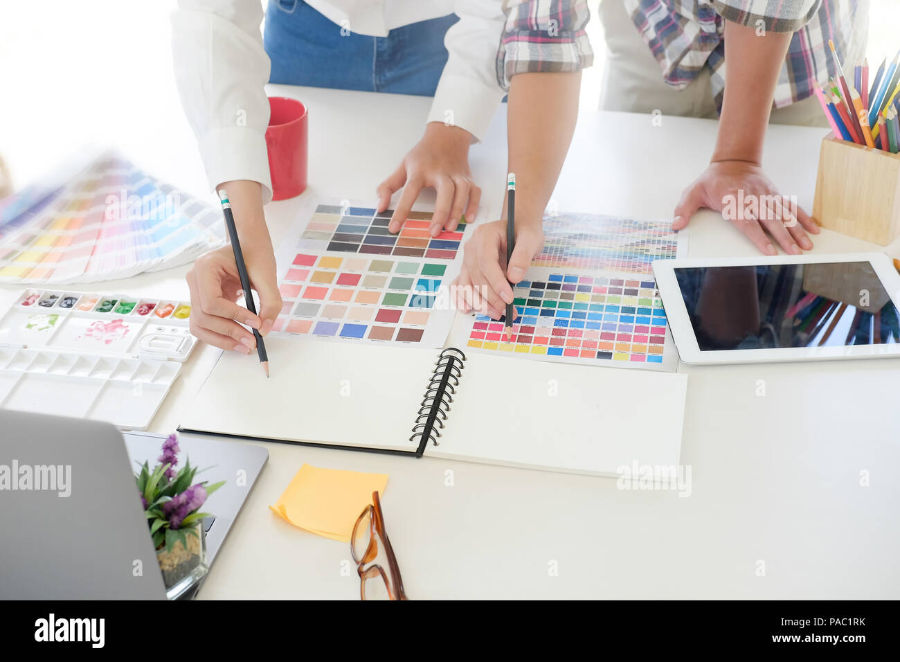 Creative graphic designer sketch pencil on notebook paper with pre ...