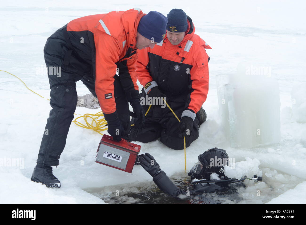 A Michigan State Police Underwater Recovery Unit diver recovers a fake ...