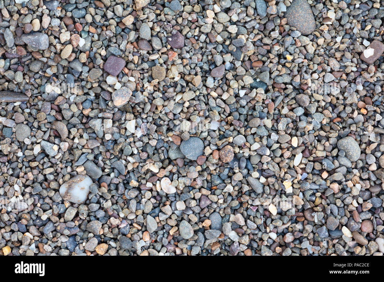 Small stones pebbles sand background Stock Photo - Alamy