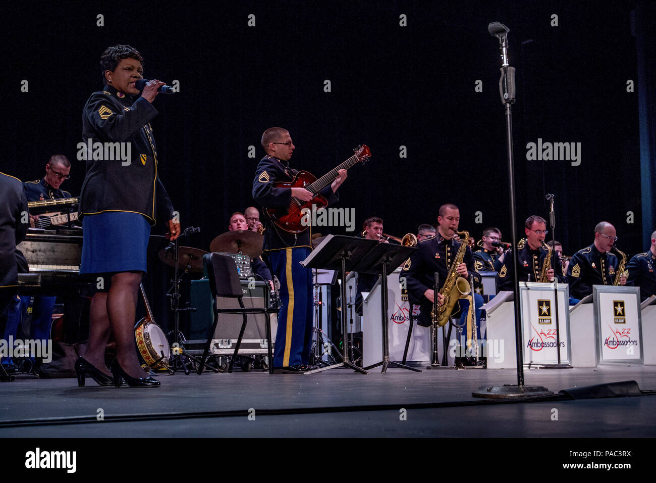 Master Sgt. Marva Lewis, featured vocalist, sings a Jazz tune while ...