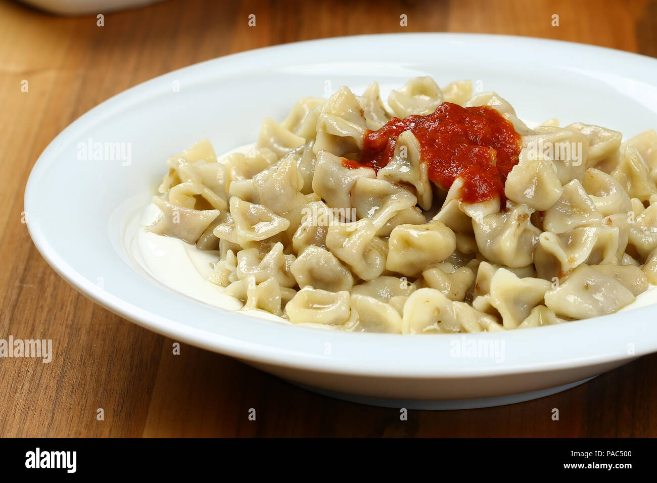 Traditional Turkish Food Manti Ravioli with Yoghurt Stock Photo - Alamy
