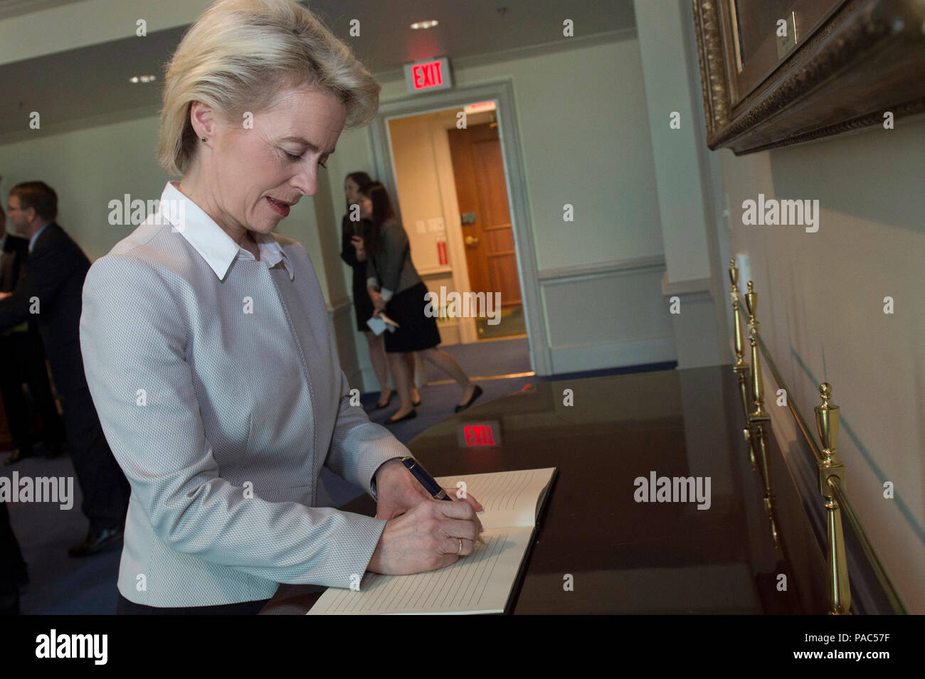 Germany's Minister of Defense Ursula von der Leyen signs as guest book ...