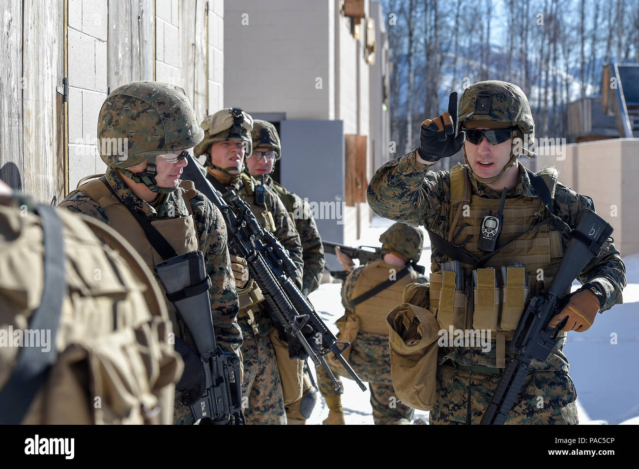 U.S. Marine Corps Cpl. William Worthy, right, assigned to Detachment ...