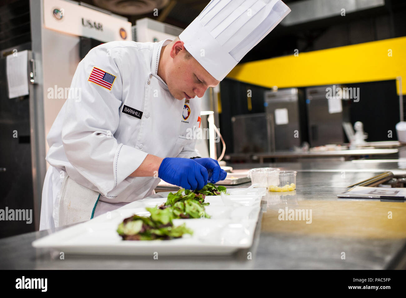 U.S. Army Reserve Culinary Arts Team member, Sgt. Joshua Barnhill, with ...