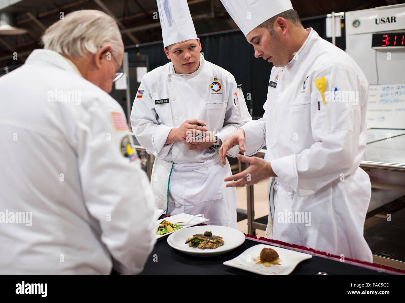 U.S. Army Reserve Culinary Arts Team member Staff Sgt. Joseph Parker ...
