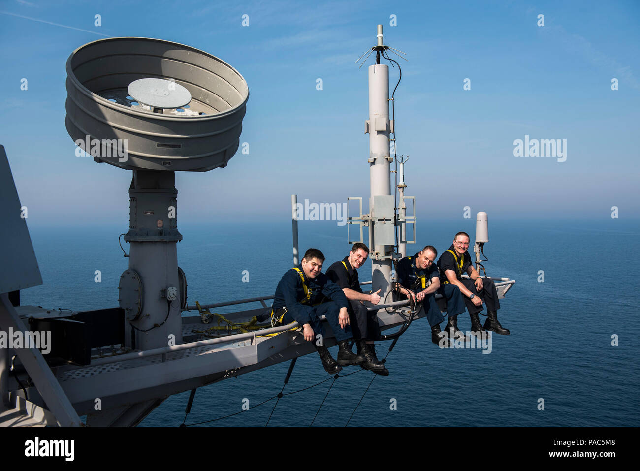 160304-N-NU281-284 ARABIAN GULF (March 4, 2016) Sailors pose for a ...