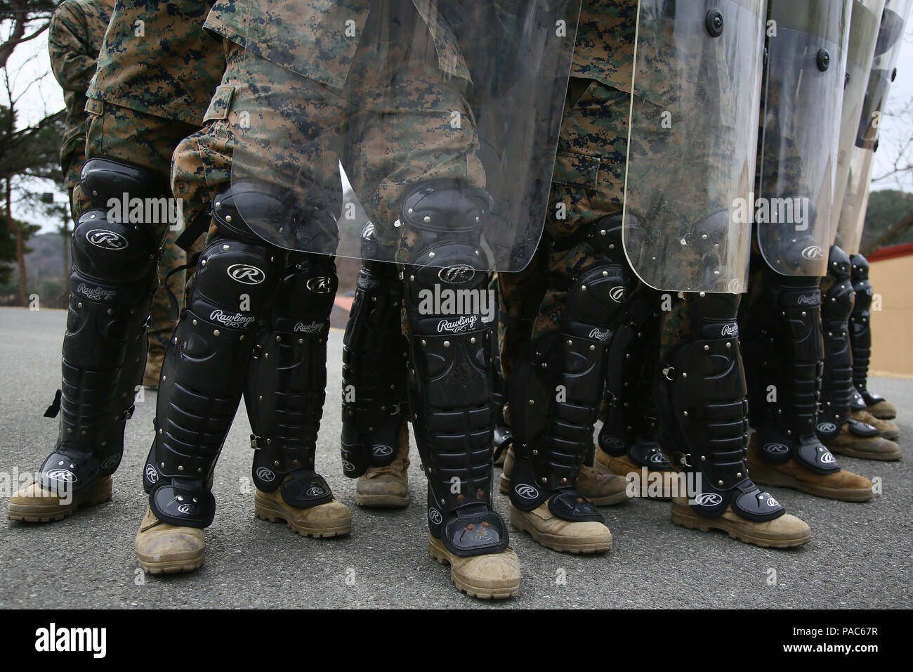U.S. Marines with 3d Law Enforcement Battalion wear protective gear ...