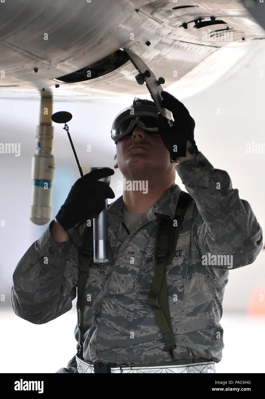 Staff Sgt. Anthony Mathieu performs a through flight inspection on an F ...