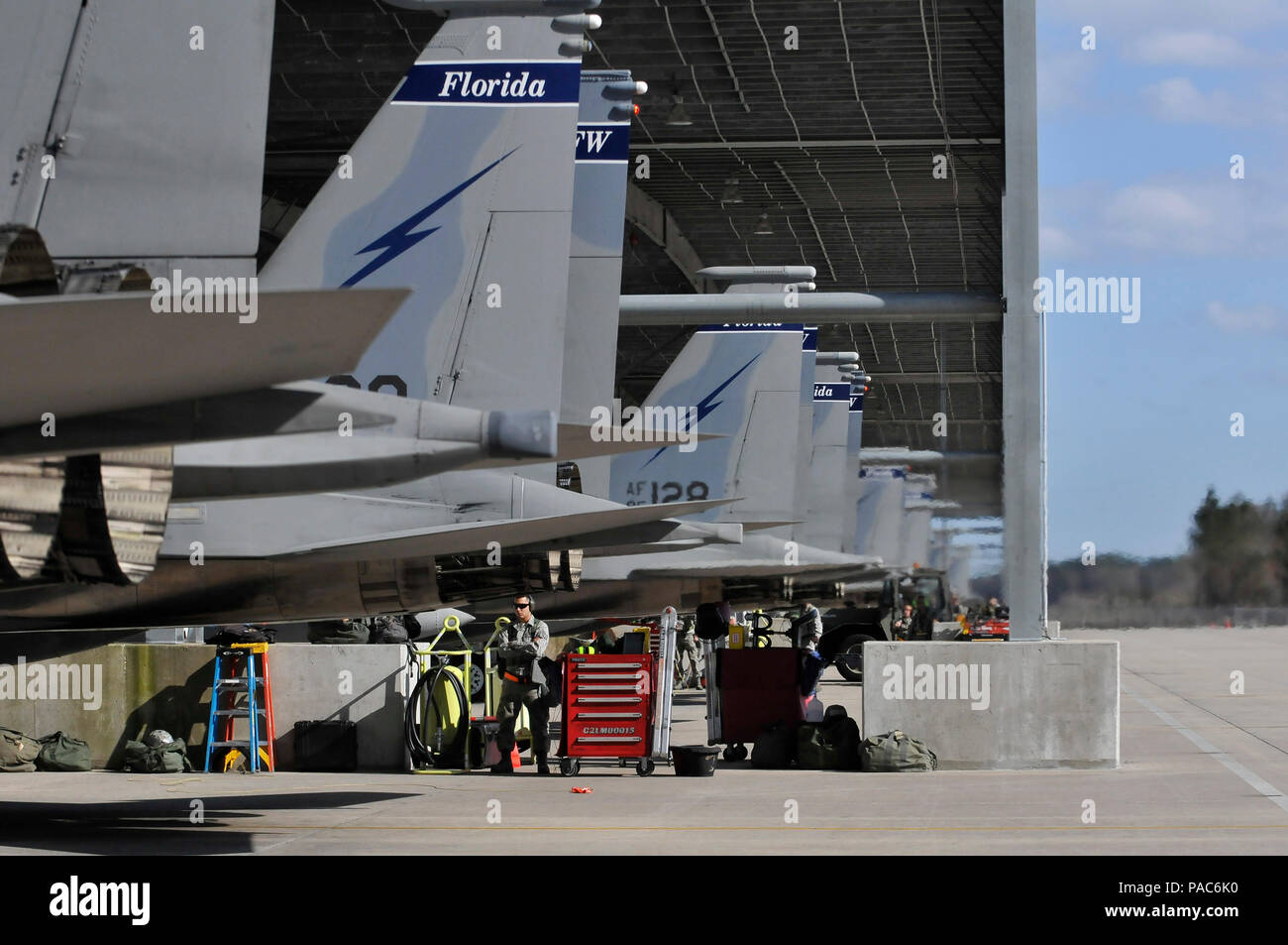 Crew chiefs perform through flight inspections on F-15s during the ...