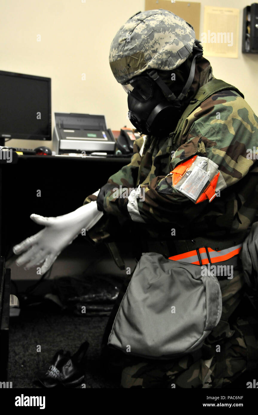 Master Sgt. Nathaniel Legree dons full MOPP4 chemical warfare gear ...