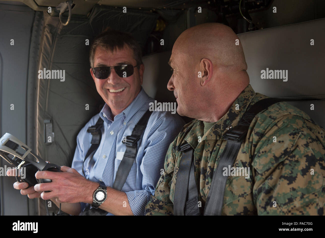 Secretary of Defense Ash Carter shares a light moment with Brig. Gen ...