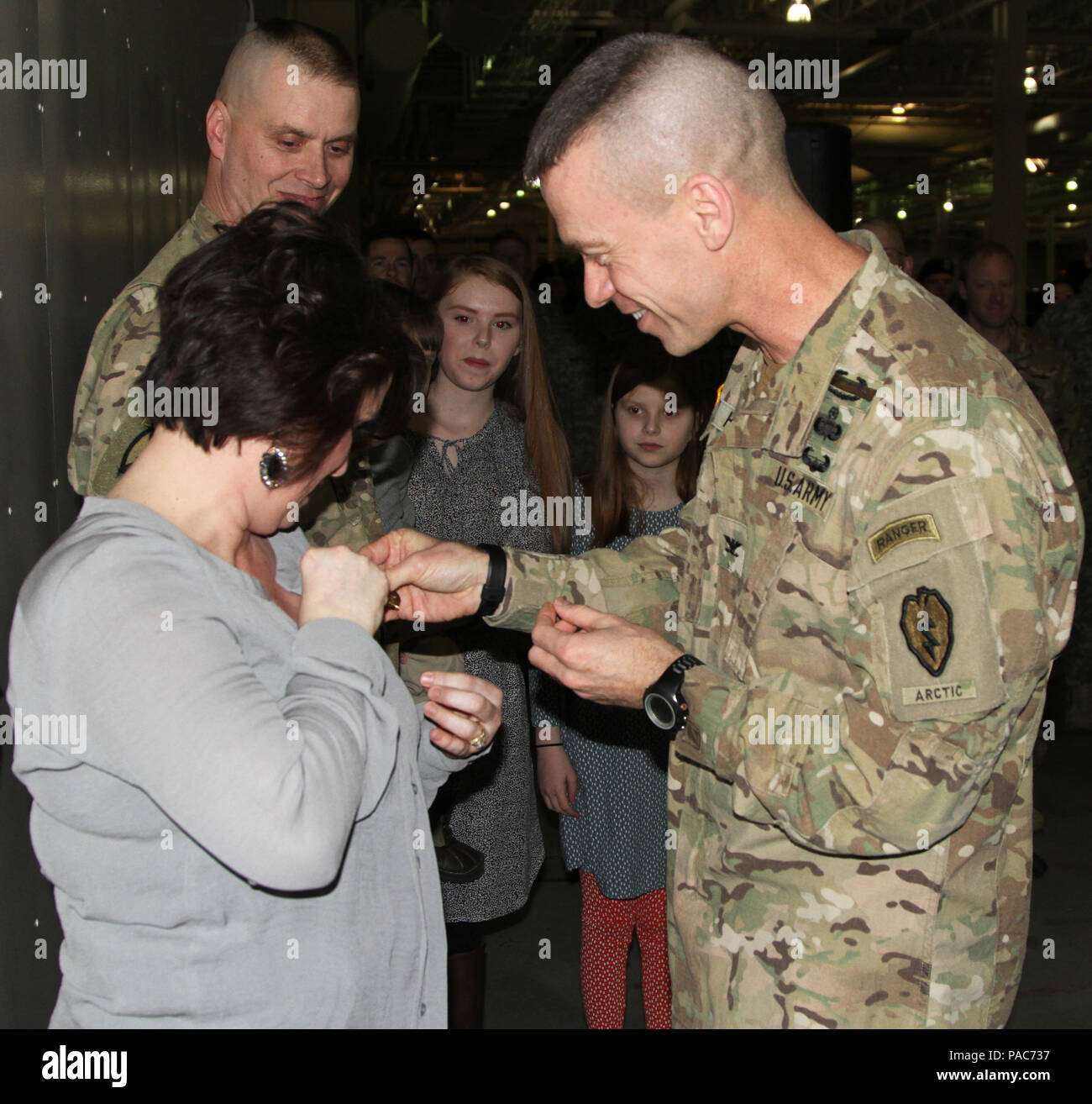 Misty Bass, Command Sgt. Maj. David W. Bass's spouse, receives a ...