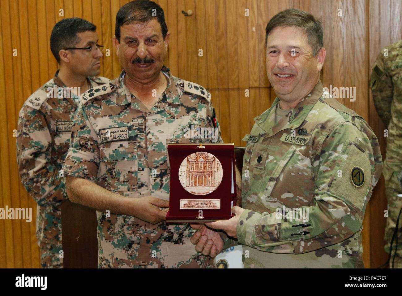 Brig. Gen. Jumah Al-Hrout, commander of 3rd Armored Division, presents ...