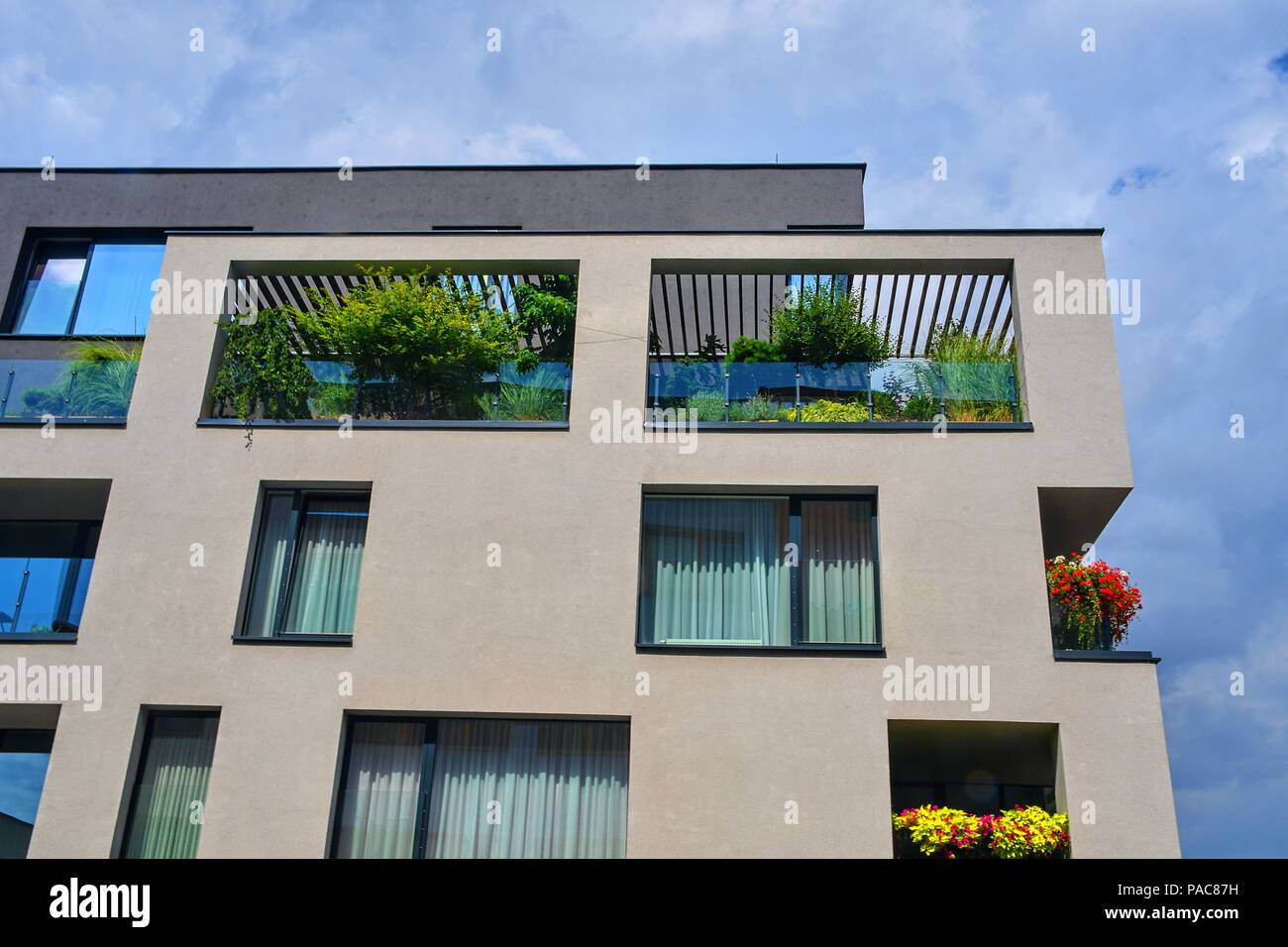 Modern architecture. Urban terrace with flowers and greenery. Urban ...