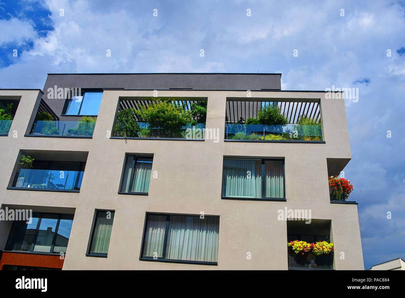 Modern architecture. Urban terrace with flowers and greenery. Urban ...